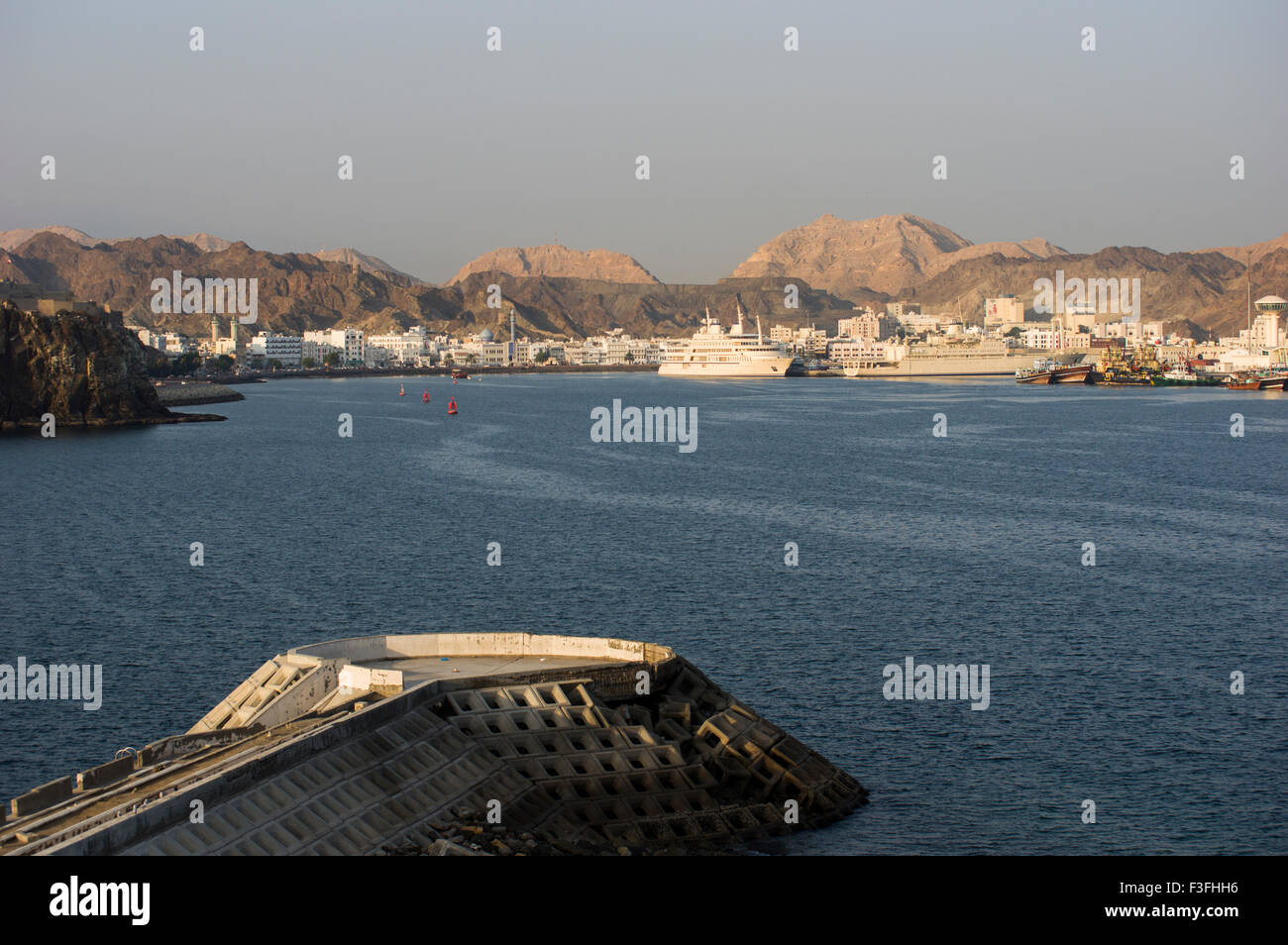 Harbour of Muscat in the Sultanate of Oman with mountains and the port ...