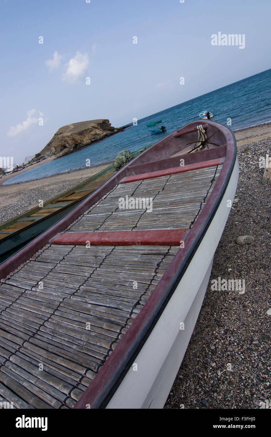 Boat on the beach in a beach village near Muscat in the Sultanate of ...