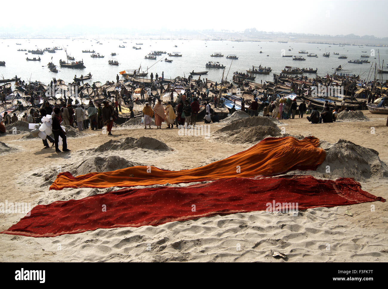 Pilgrims or devotees dry their clothes taking holy dip confluence ...