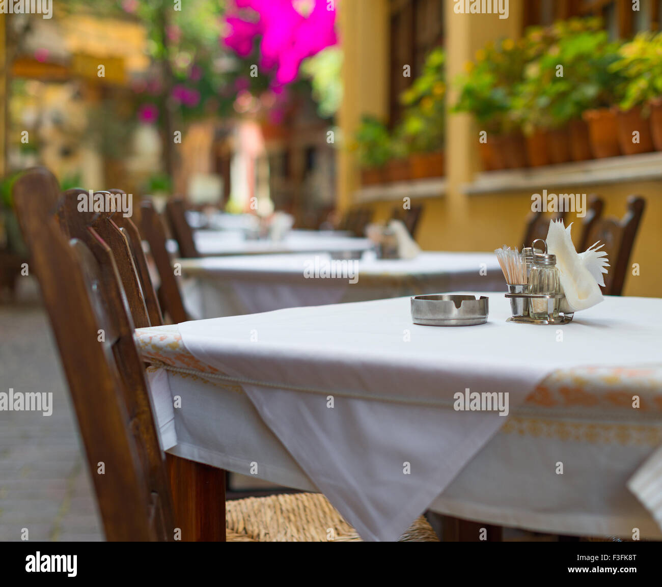 Mediterranean restaurant terrace exterior with chairs Stock Photo - Alamy