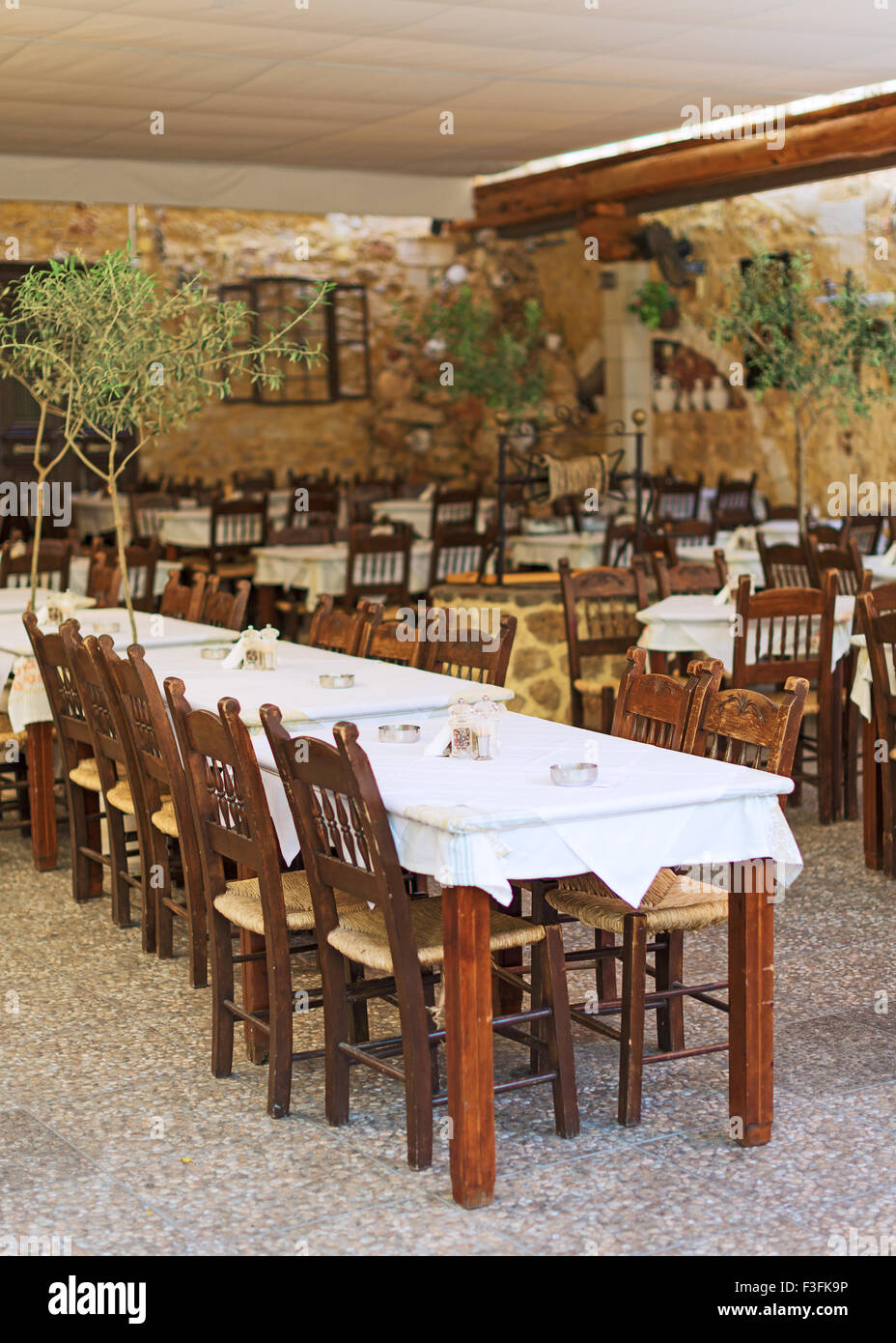 Mediterranean restaurant terrace exterior with chairs Stock Photo - Alamy