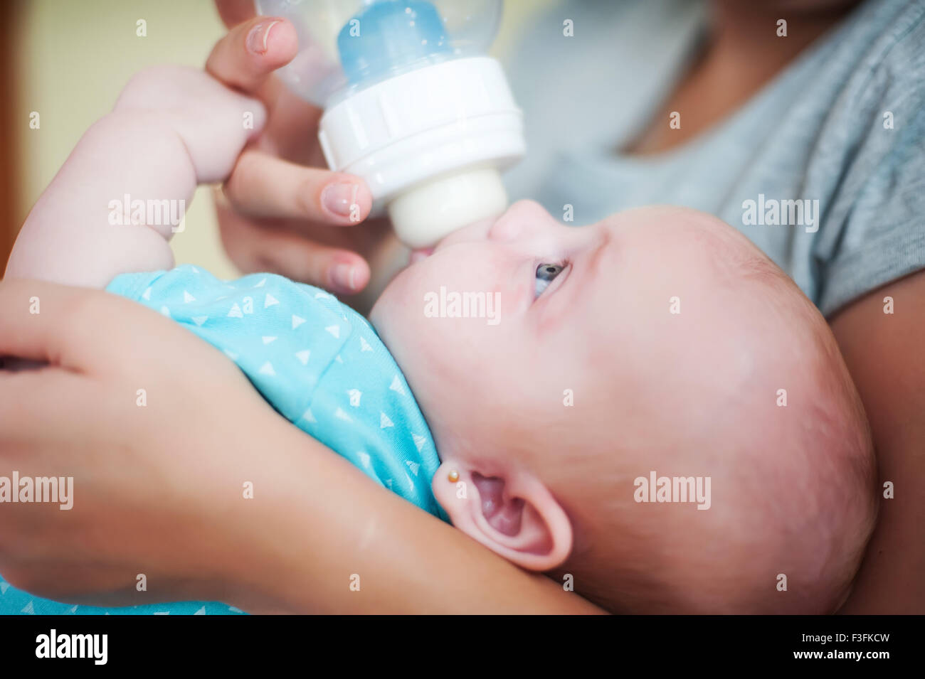 Little Baby drinking milk from a bottle Stock Photo - Alamy