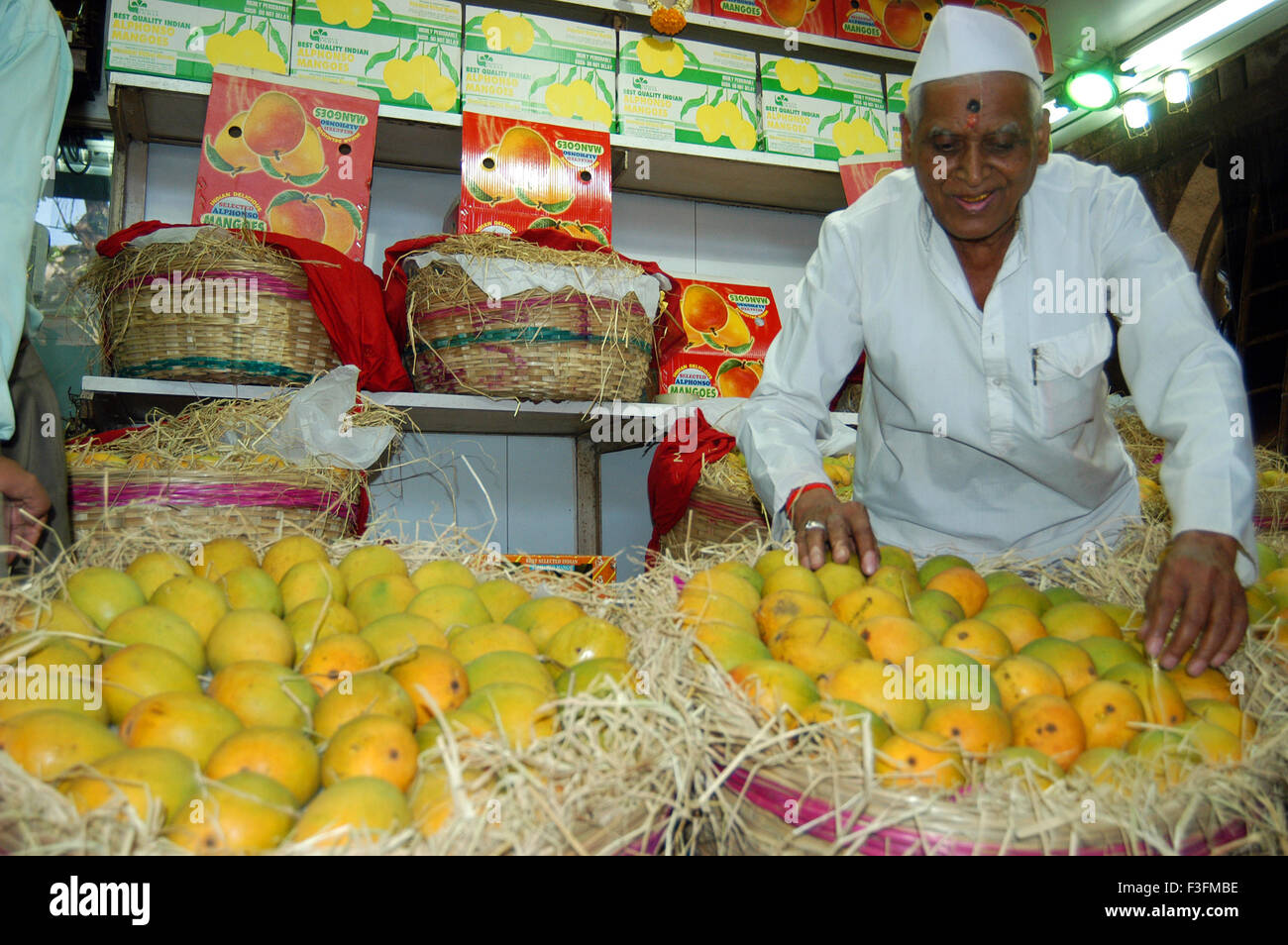A fruit seller sells Alphonso mangoes at Crawford Market in Bombay now ...