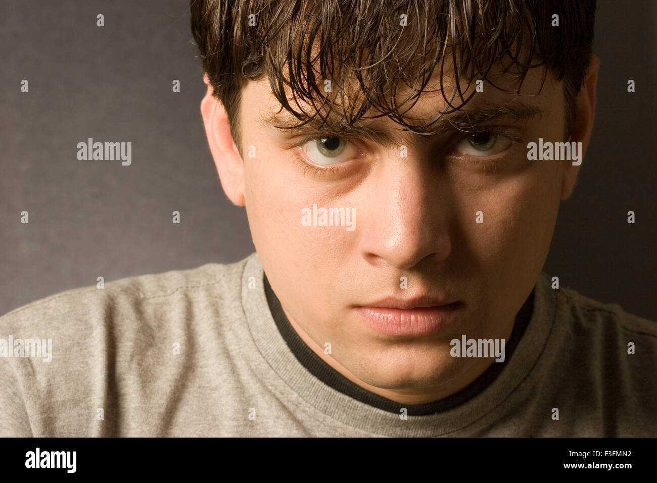 Portrait of boy looking in anger MR#729B Stock Photo - Alamy