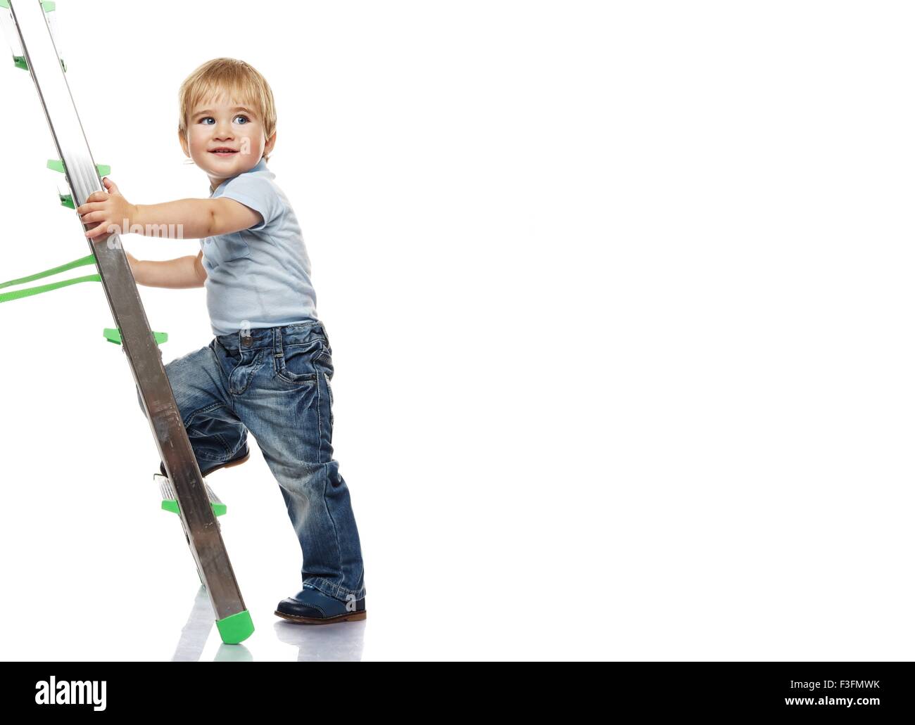 Cute little boy climbing on a ladder Stock Photo - Alamy