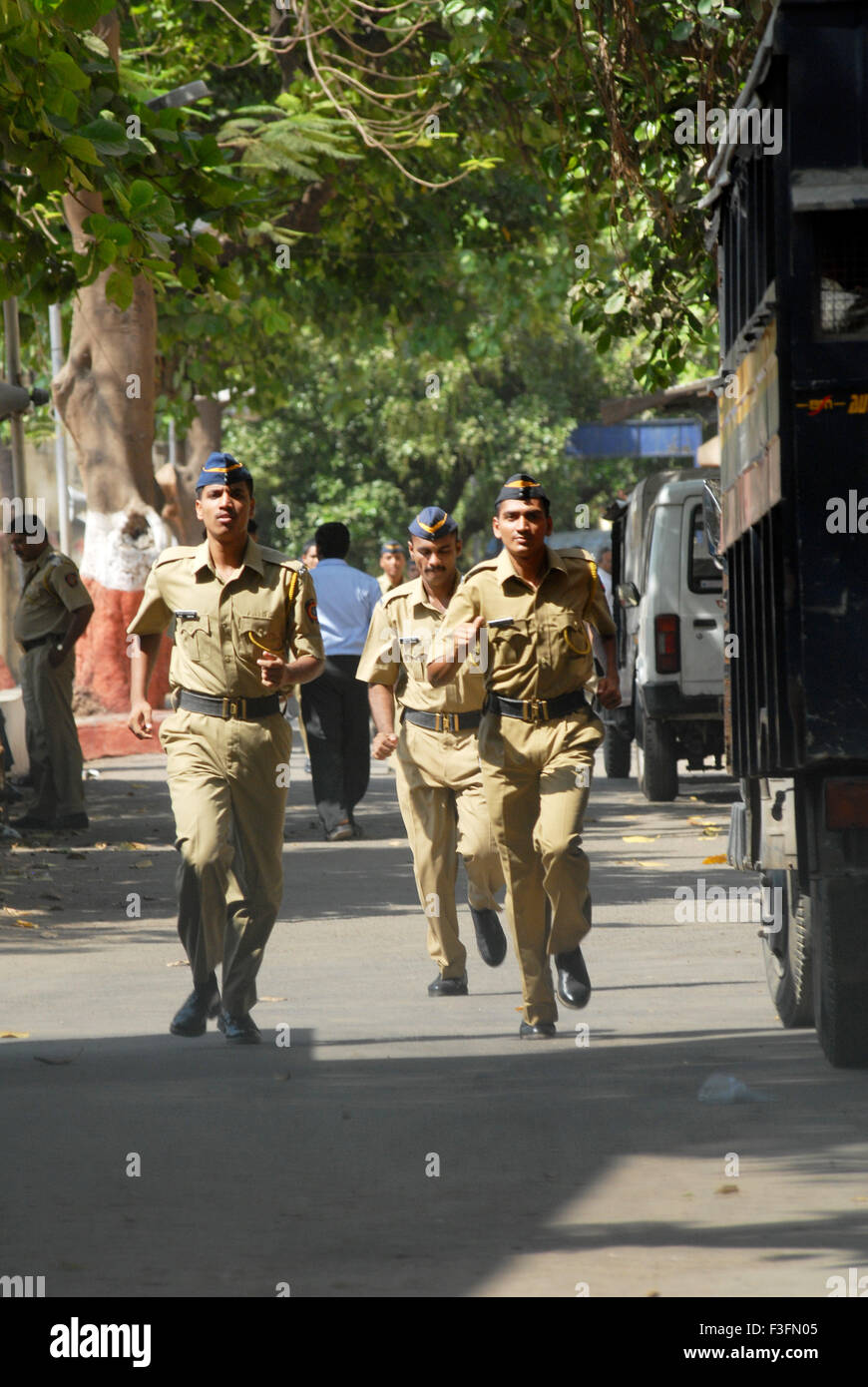 Police running hi-res stock photography and images - Alamy