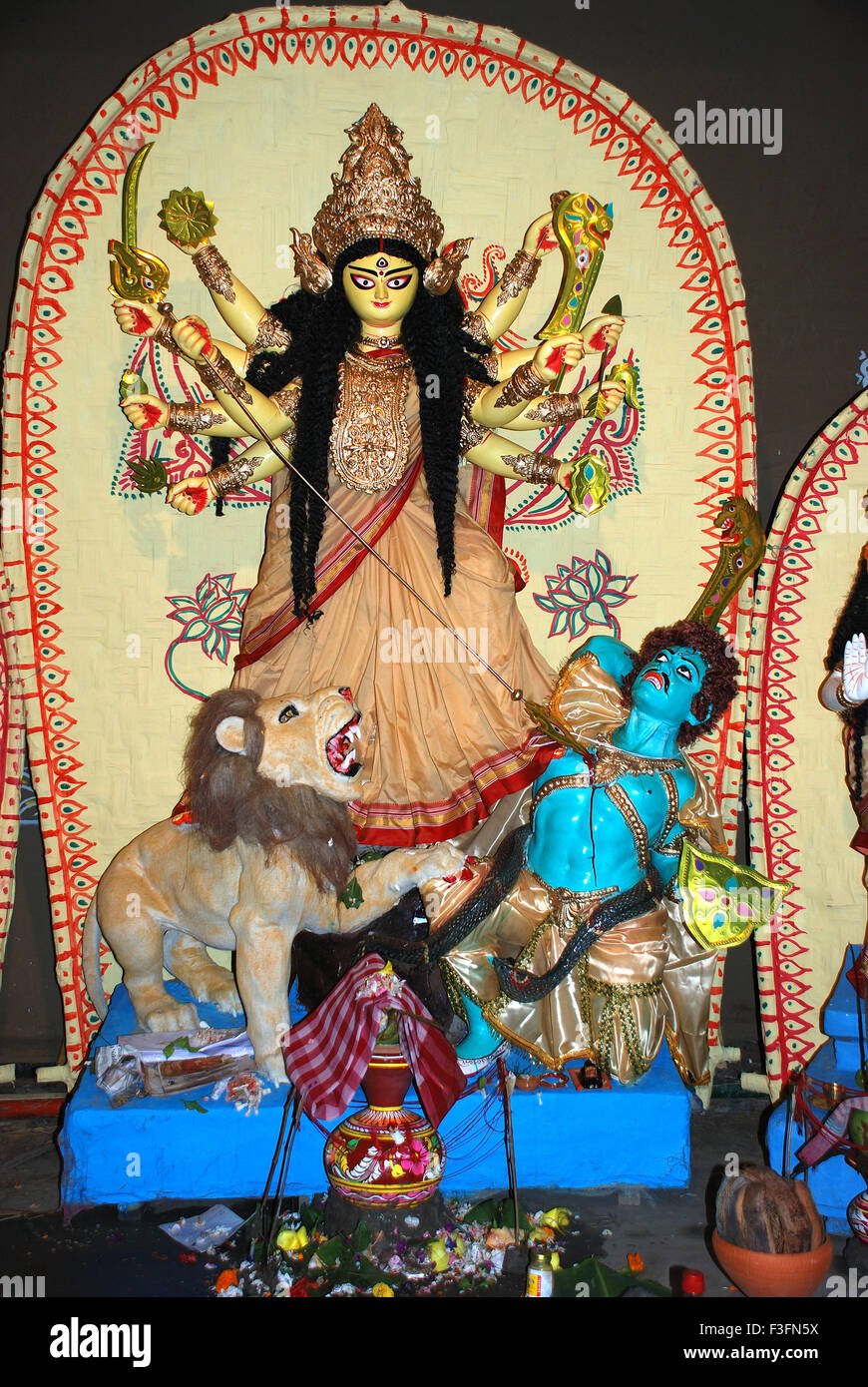 Durga clay model holding weapons killing demon mahishasura on Durga ...