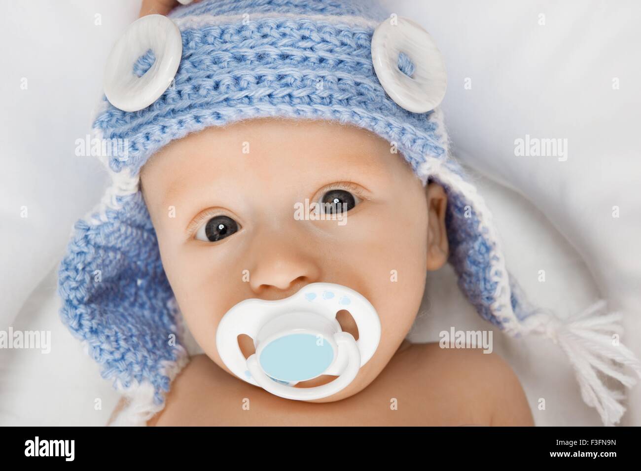 Cute baby with a pacifier Stock Photo - Alamy