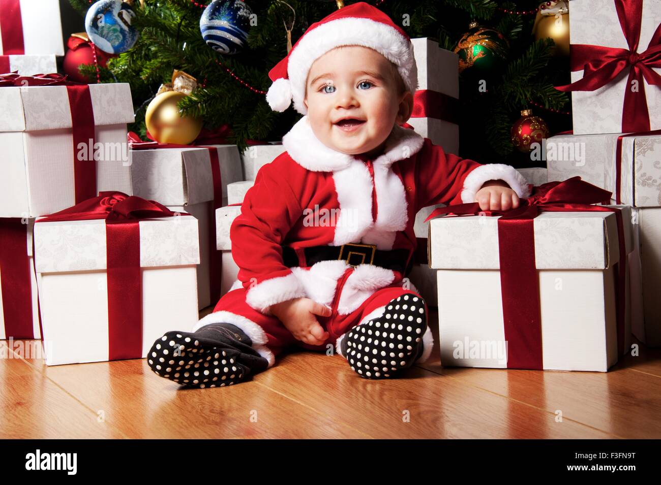 Little boy with gift boxes Stock Photo - Alamy