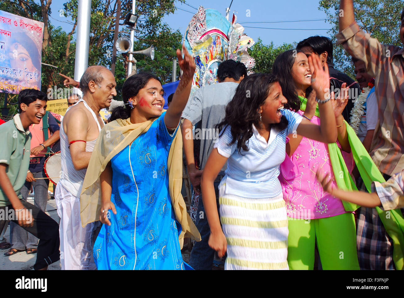 Devotees dancing on durga immersion Stock Photo - Alamy