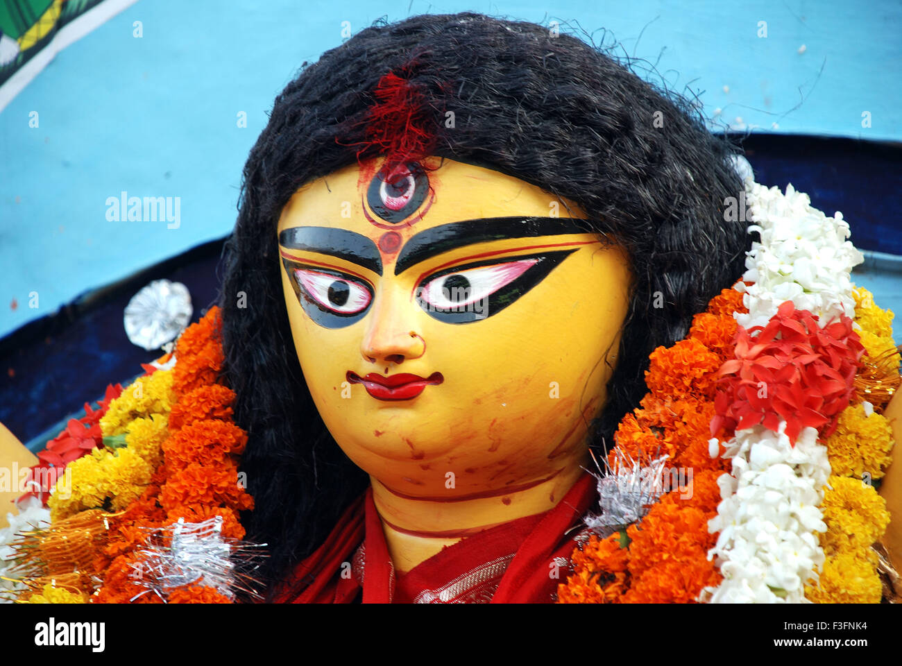 Durga clay model showing third eye open on Durga puja Stock Photo - Alamy