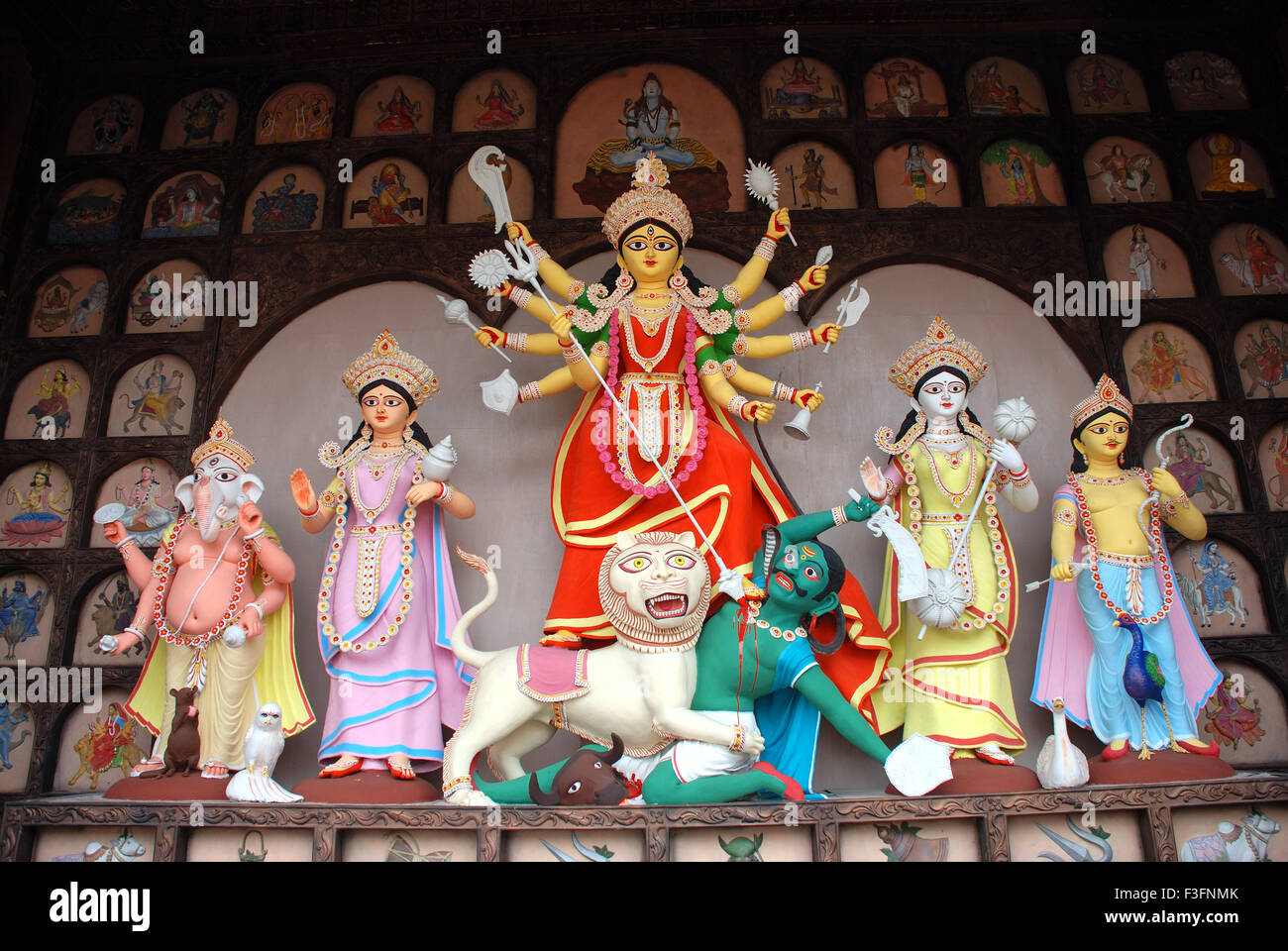 Durga clay model killing demon mahishasura with statues of kartikeya ...