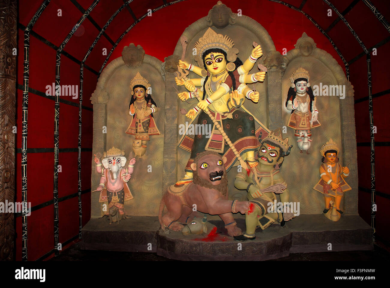 Durga clay model killing demon mahishasura with statues of kartikeya ...