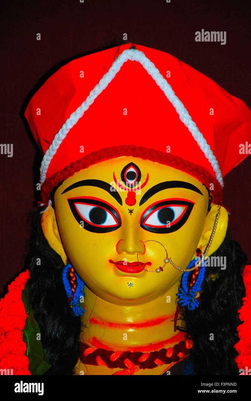 Durga clay model showing third eye open on Durga puja Stock Photo - Alamy