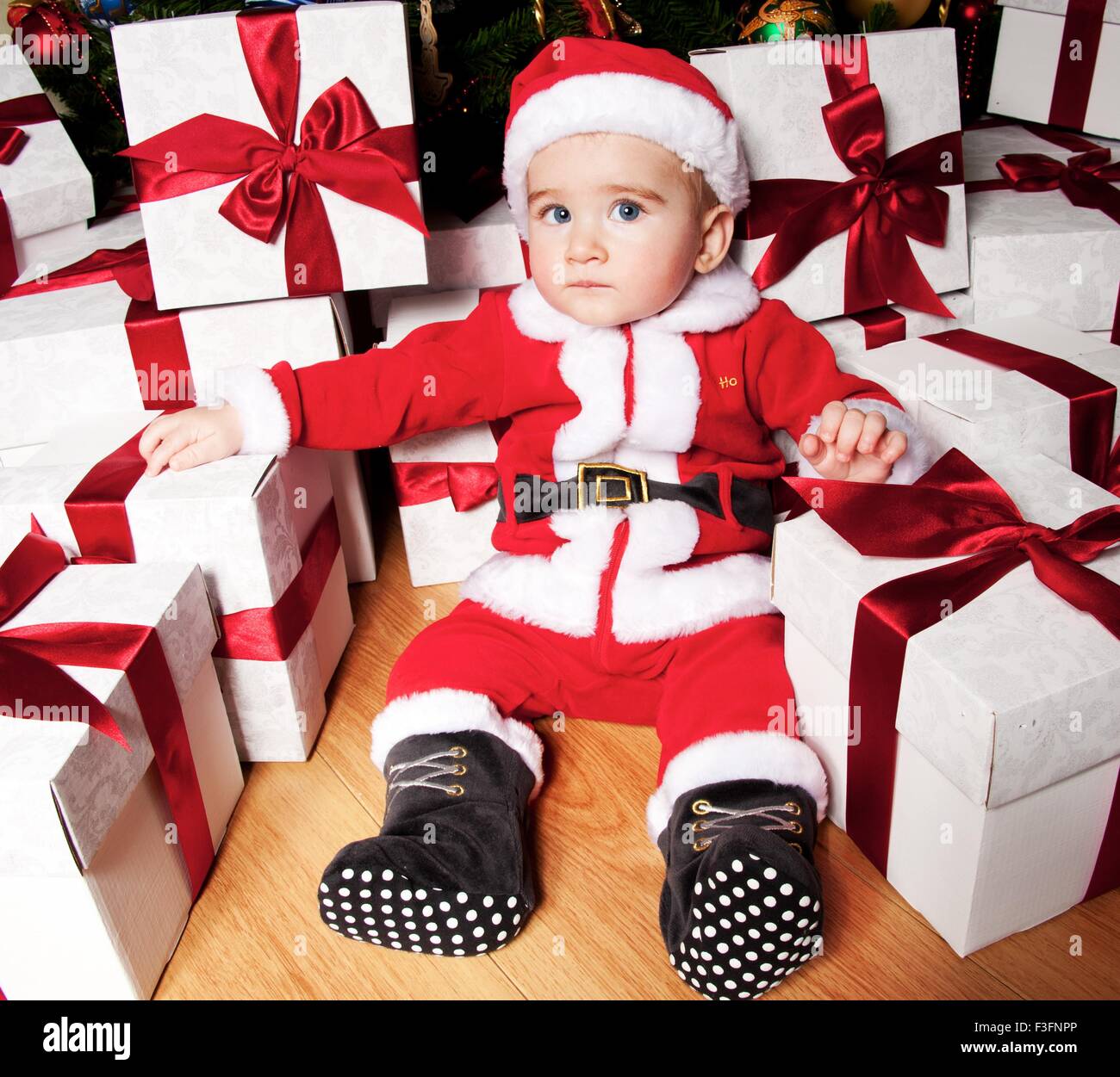 Little boy with gift boxes Stock Photo - Alamy