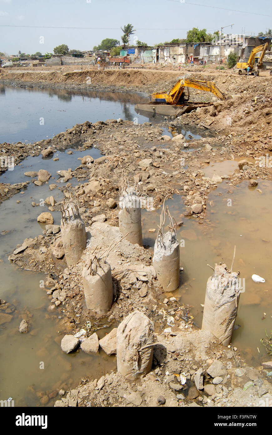 Removing debris and silt from Mithi River, Mahim River, Bombay, Mumbai ...