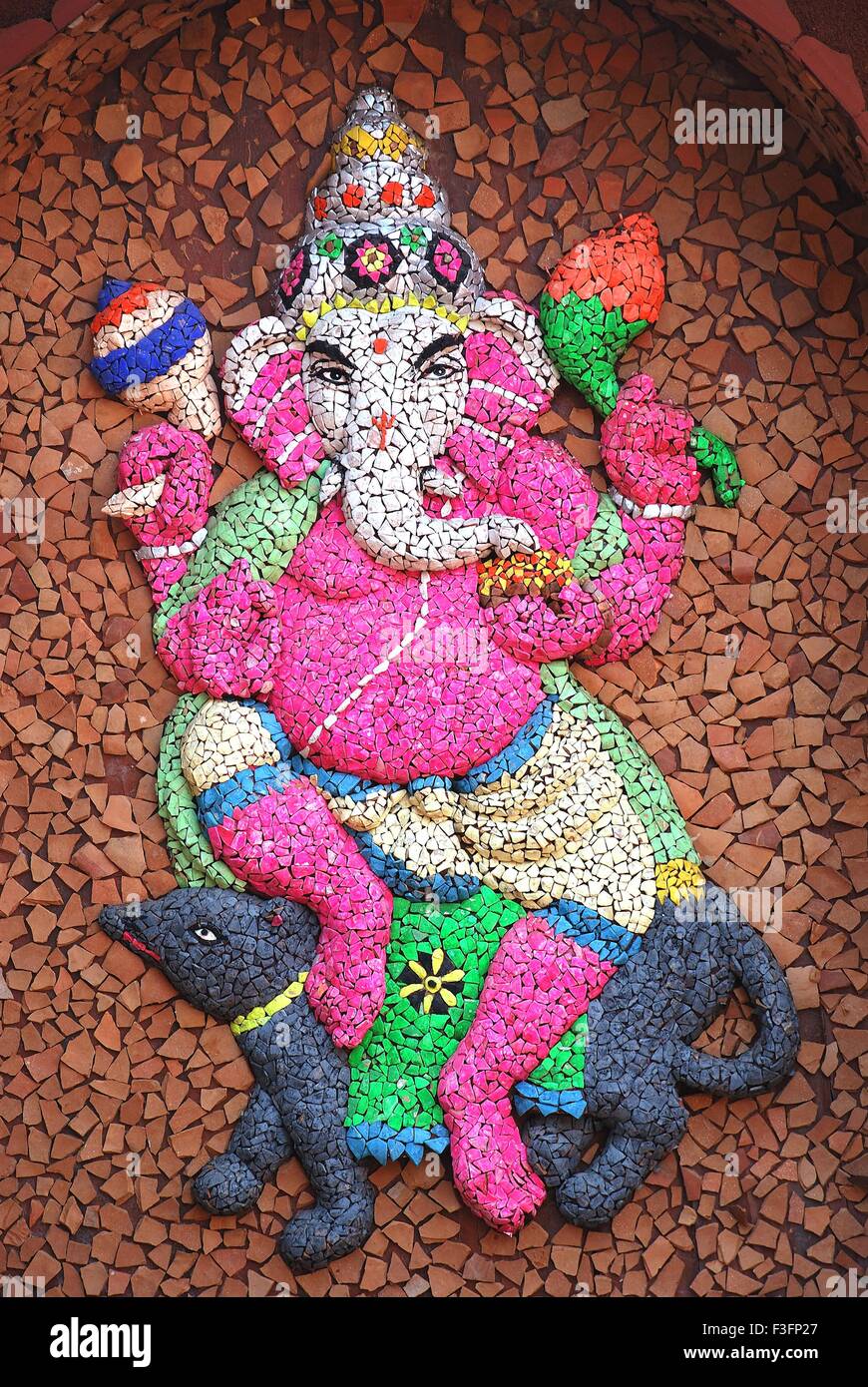 Decorative statue of lord Ganesha riding on mouse made by tiles Stock ...