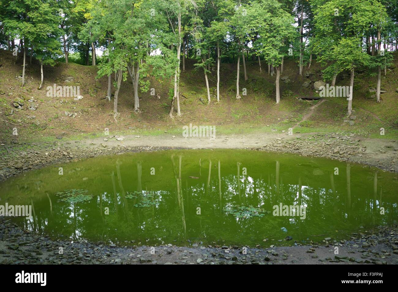 Small lake in meteor crater Stock Photo - Alamy