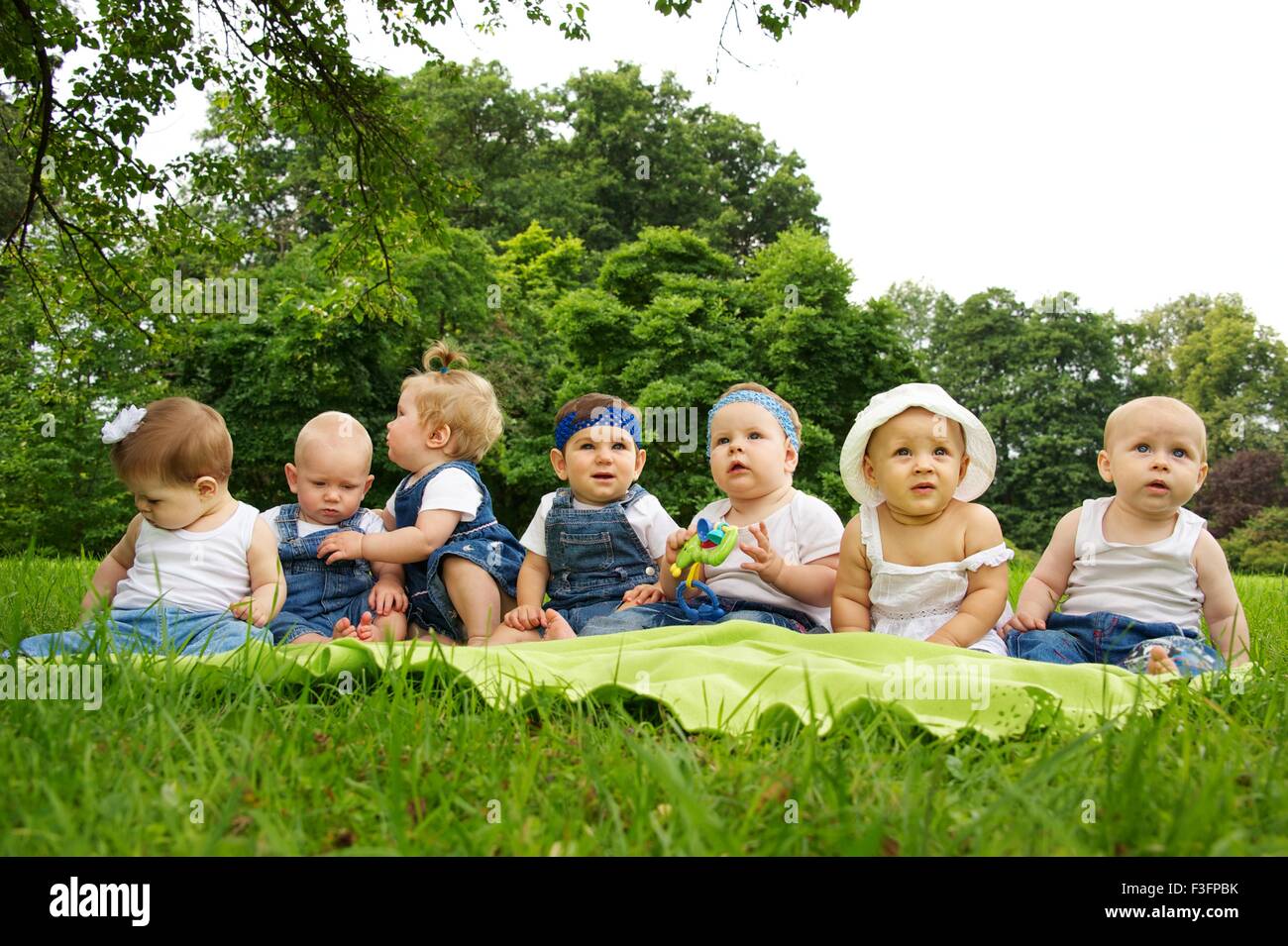 Group of babies outdoors Stock Photo - Alamy