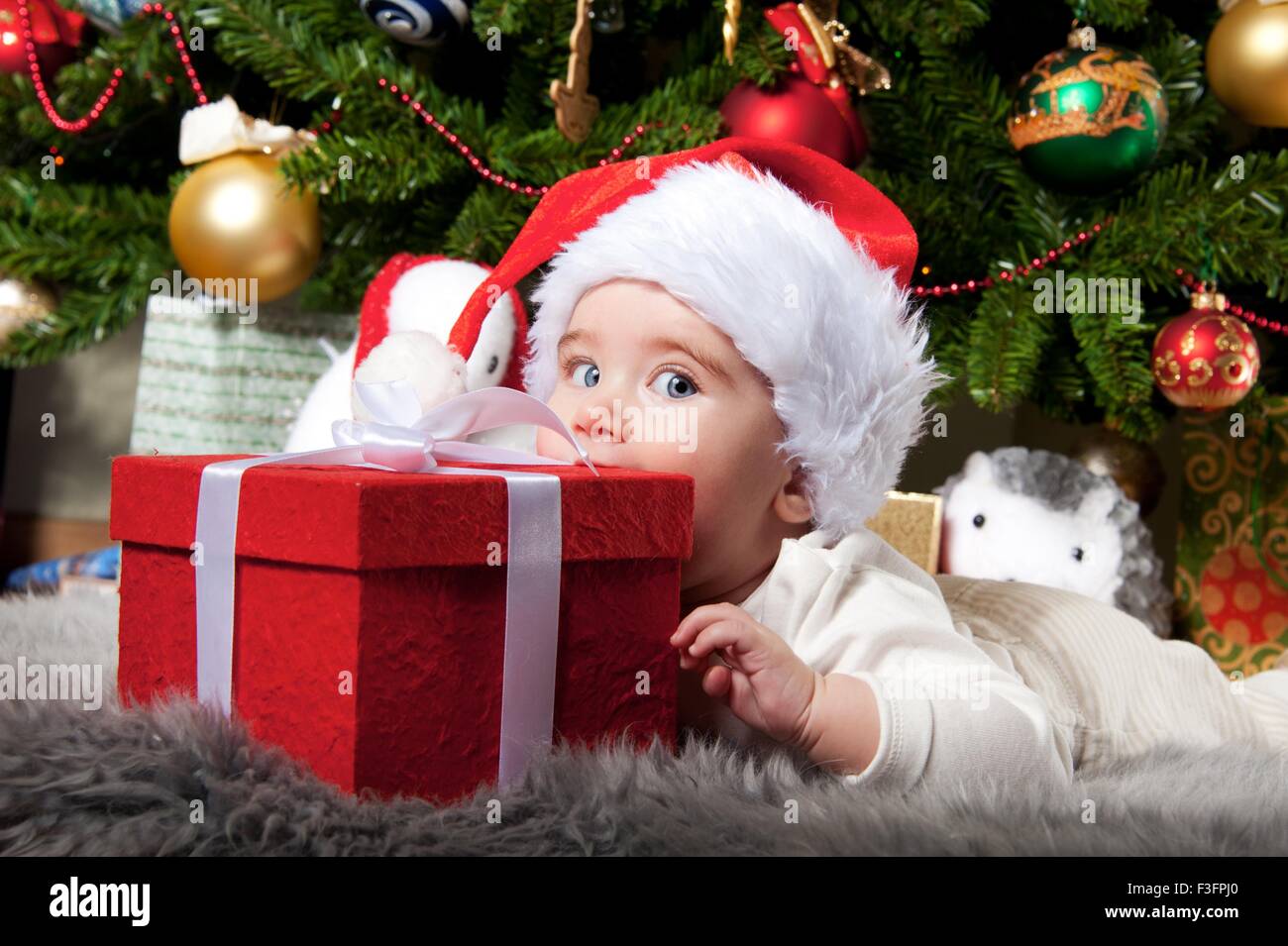 Little boy with a gift box Stock Photo - Alamy