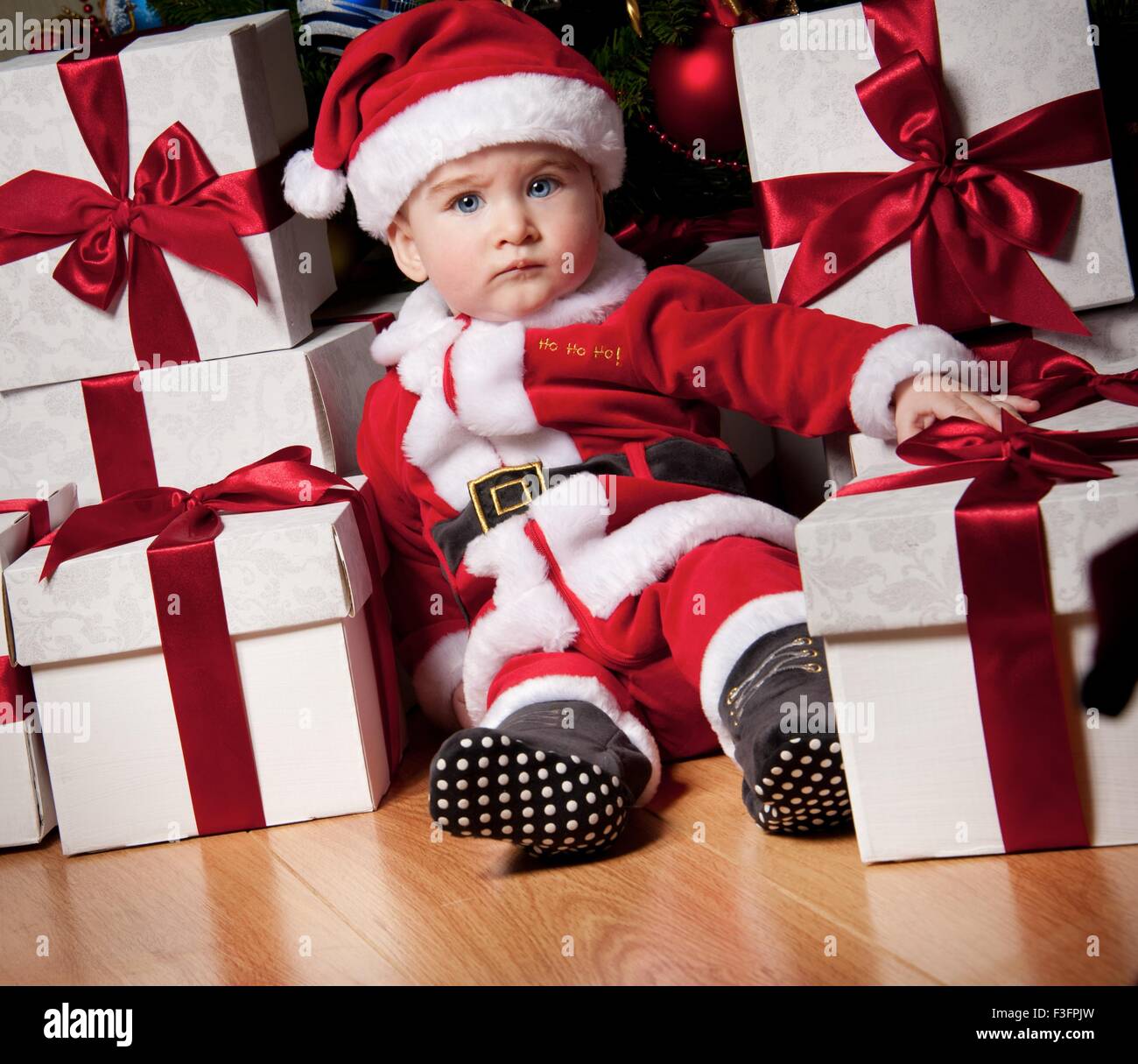 Little boy with a gift boxes Stock Photo - Alamy