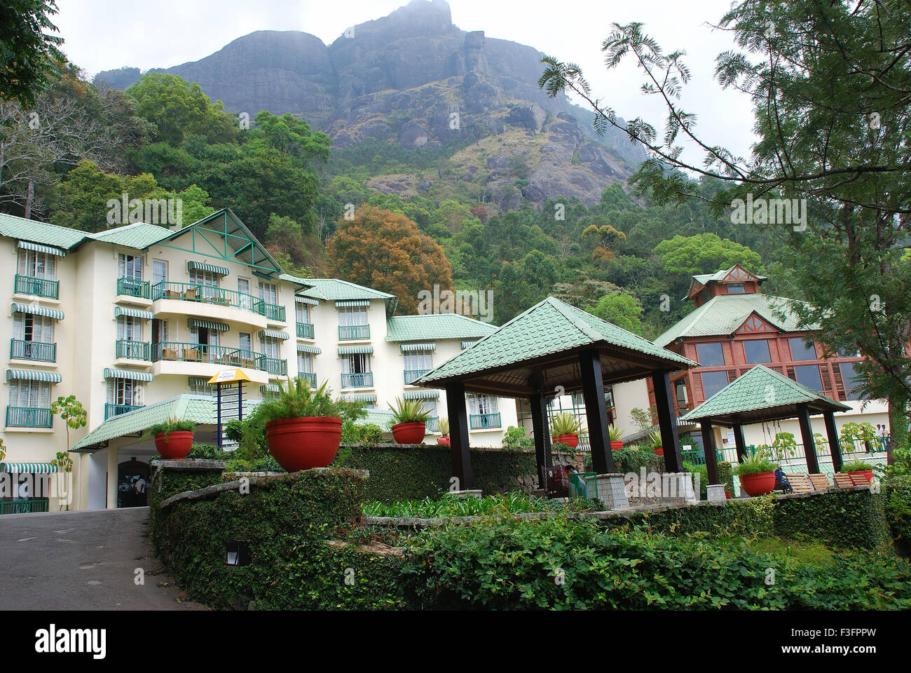 Bungalow type house and hill in background Stock Photo - Alamy