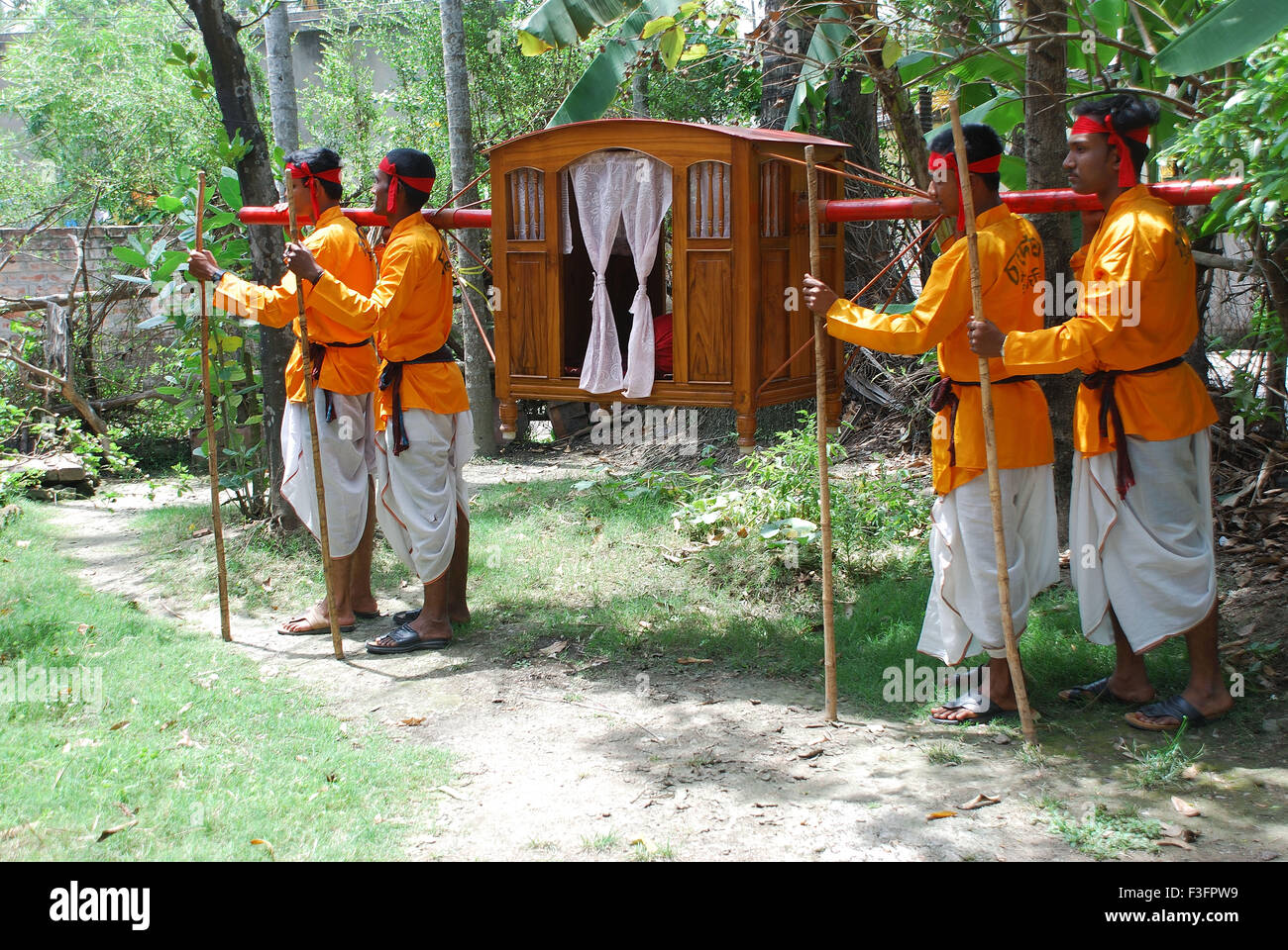 Young men carrying palanquin hi-res stock photography and images - Alamy