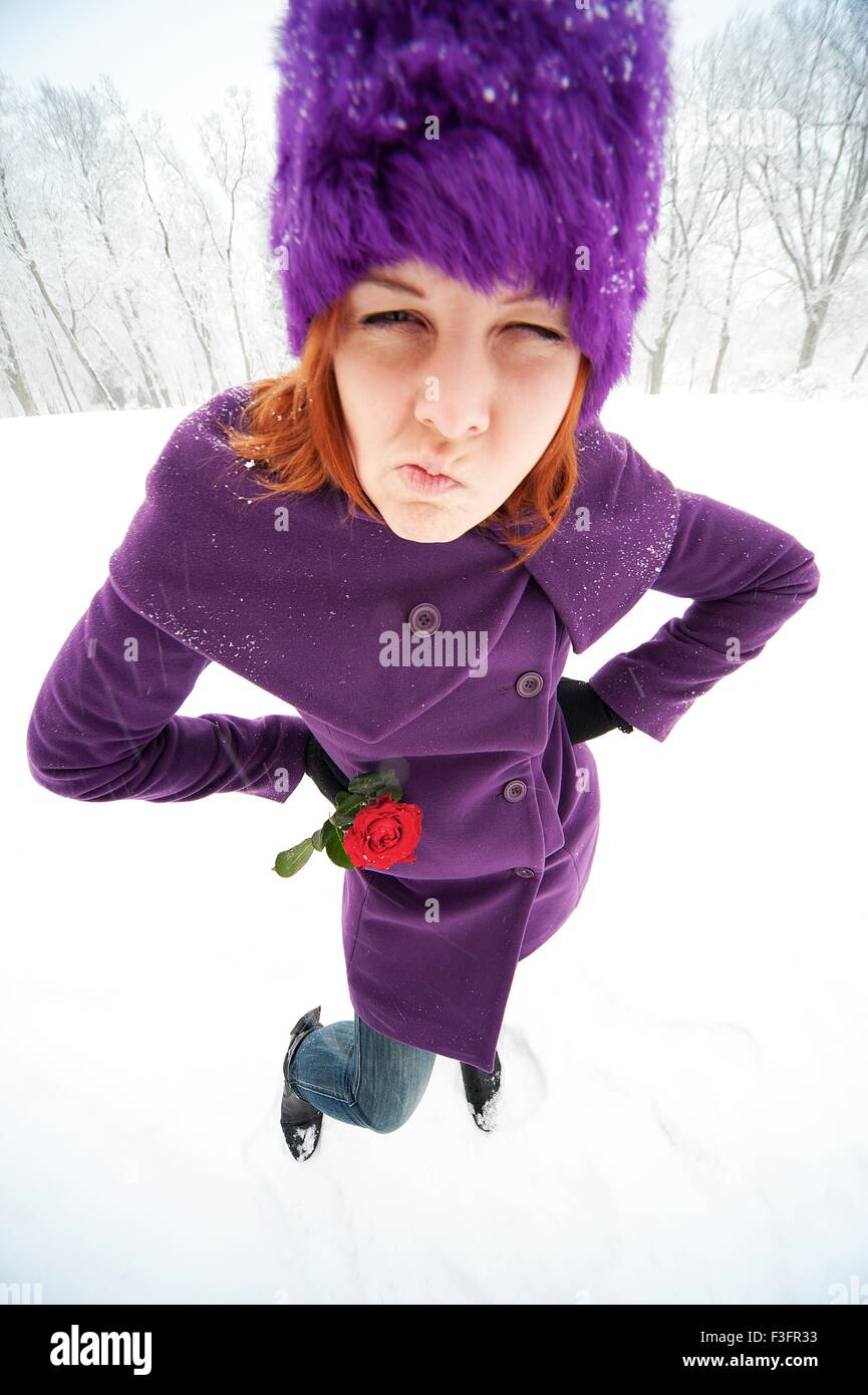 Funny girl with a red rose Stock Photo - Alamy