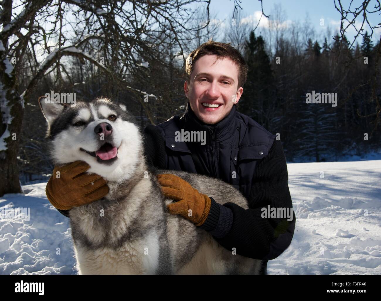 Happy man with a dog Stock Photo - Alamy