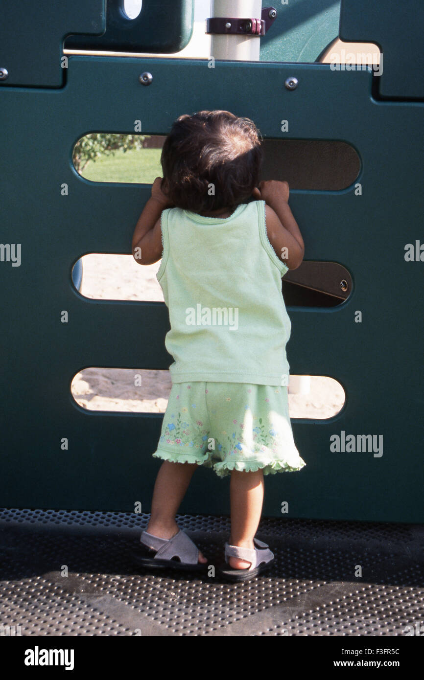 Child looking through gap hi-res stock photography and images - Alamy
