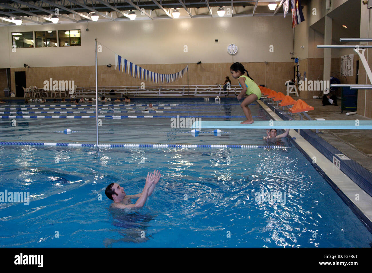 Three years old girl learning how to jump from jumping board MR#0543 ...