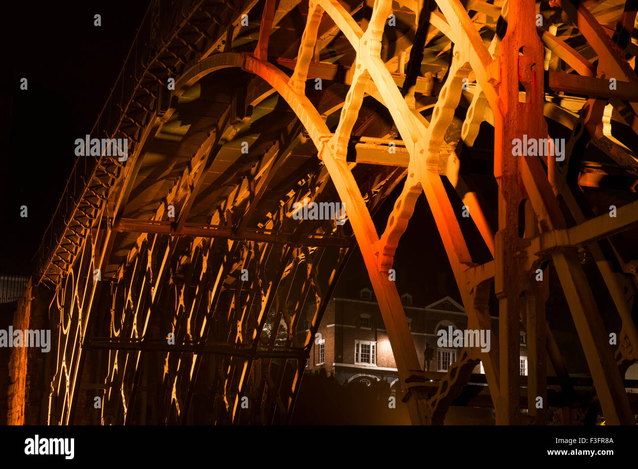 The illuminated cast iron structure of the Iron Bridge at Ironbridge ...