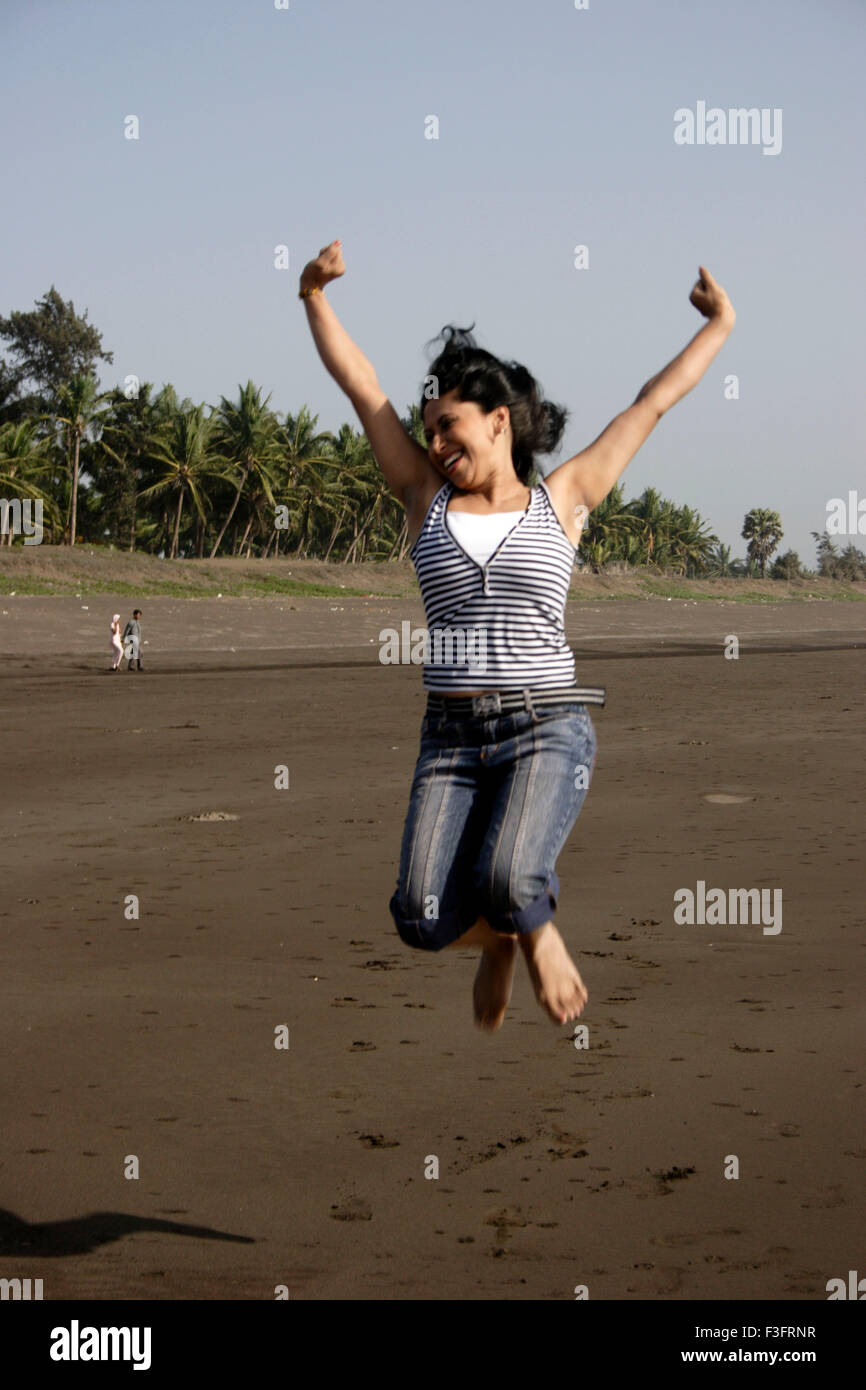 South Asian Indian woman jumping with joy MR#724 Stock Photo - Alamy