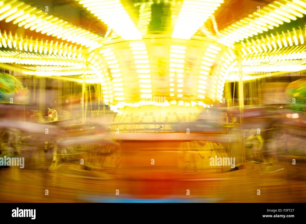 Merry-go-round in motion blur Stock Photo - Alamy