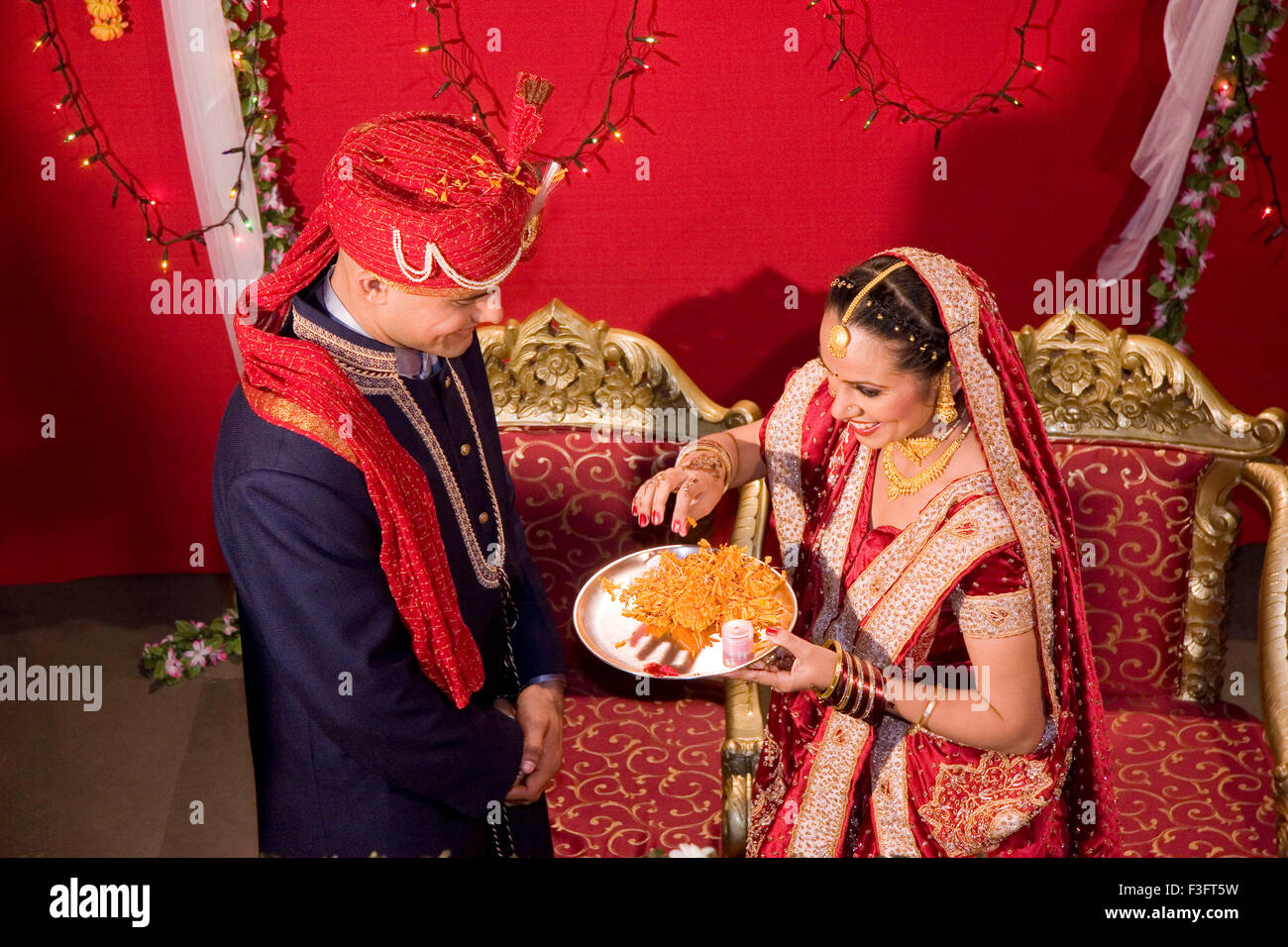 Indian bride and bridegroom performing vidhi in marriage ceremony MR ...