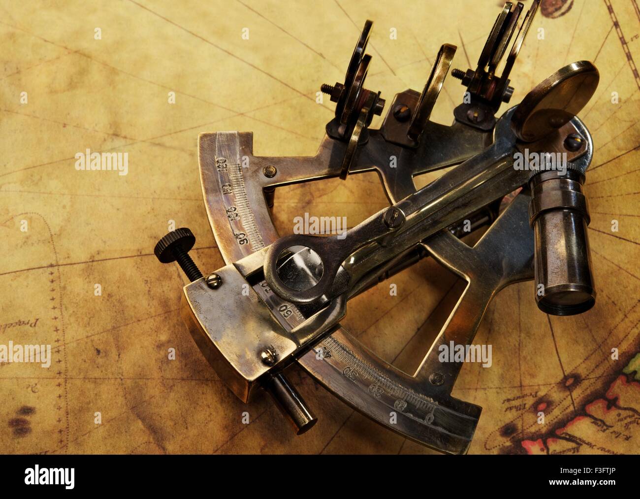 Sextant on an old map Stock Photo - Alamy