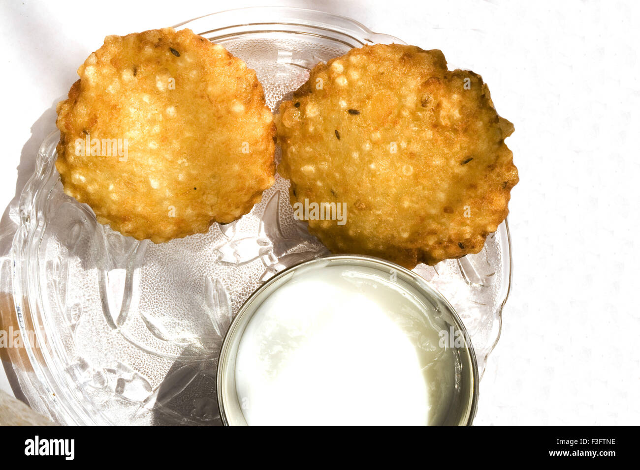 Sago Sabudana Vada with curd served in dish Stock Photo - Alamy