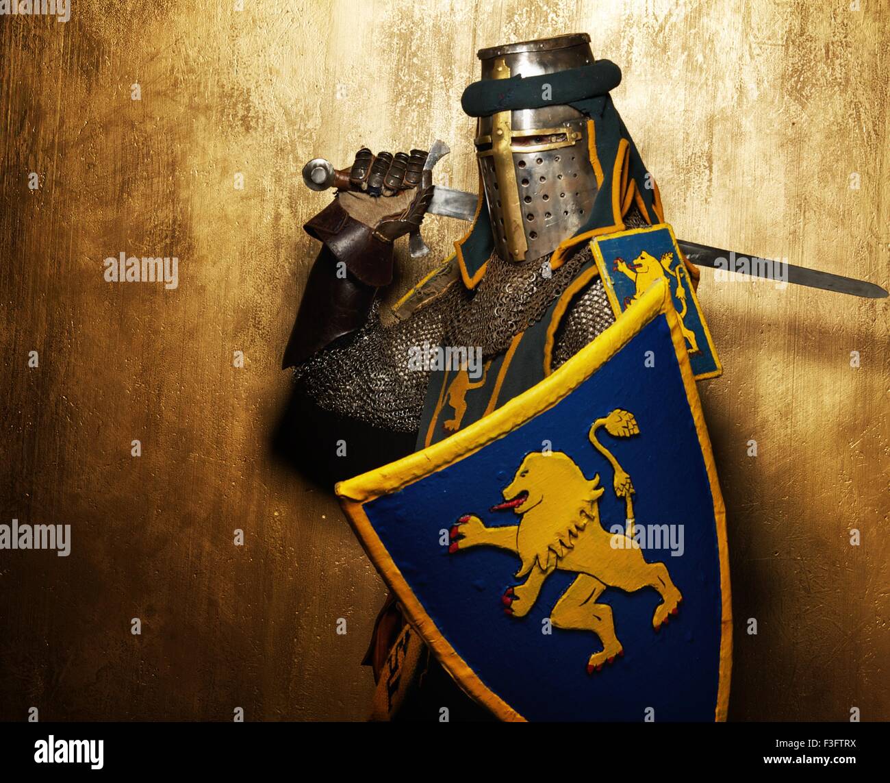 Medieval knight on golden background Stock Photo - Alamy