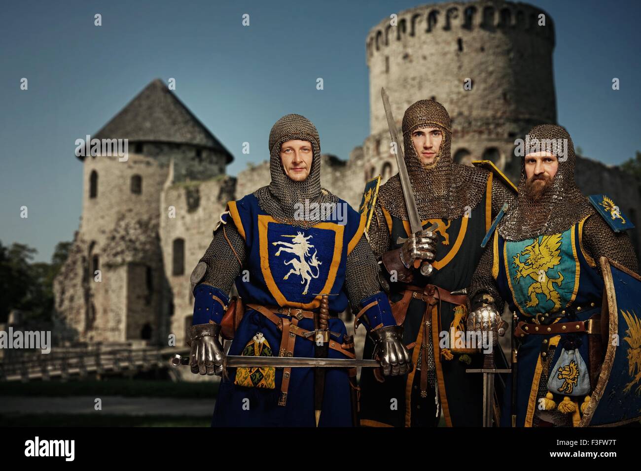 Three knights against medieval castle Stock Photo - Alamy