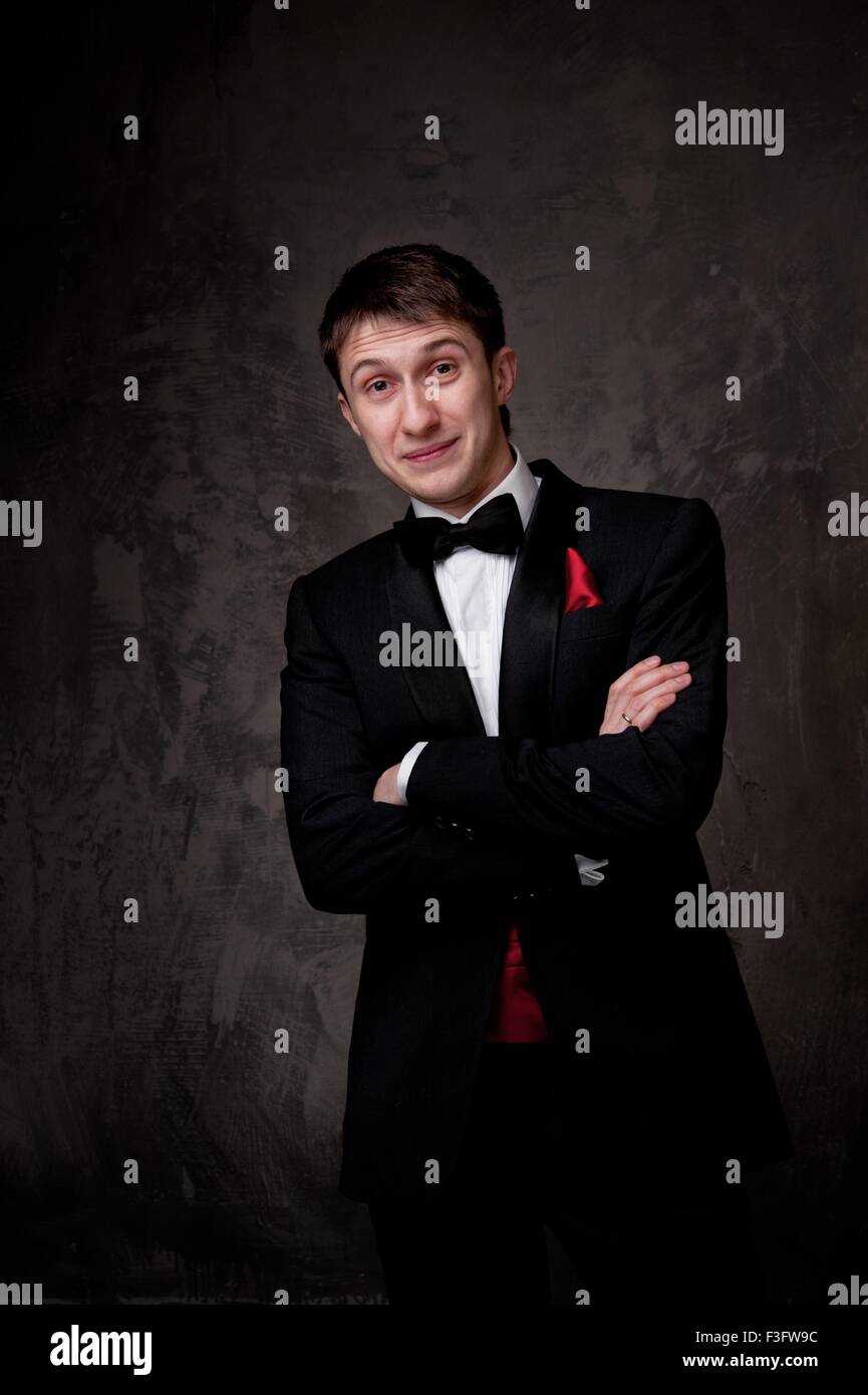 Funny young man wearing tuxedo Stock Photo - Alamy