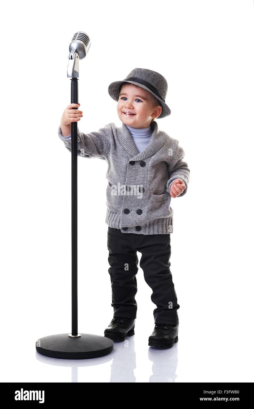 Baby boy with a microphone Stock Photo - Alamy