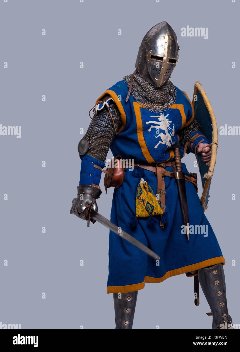 Medieval knight on grey background Stock Photo - Alamy