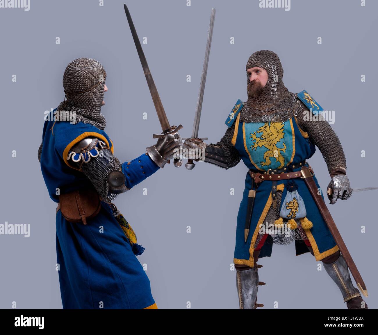 Two medieval knights fighting Stock Photo - Alamy