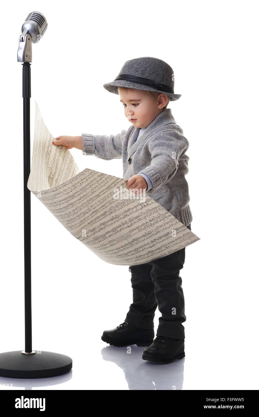 Baby boy reading music notes Stock Photo - Alamy
