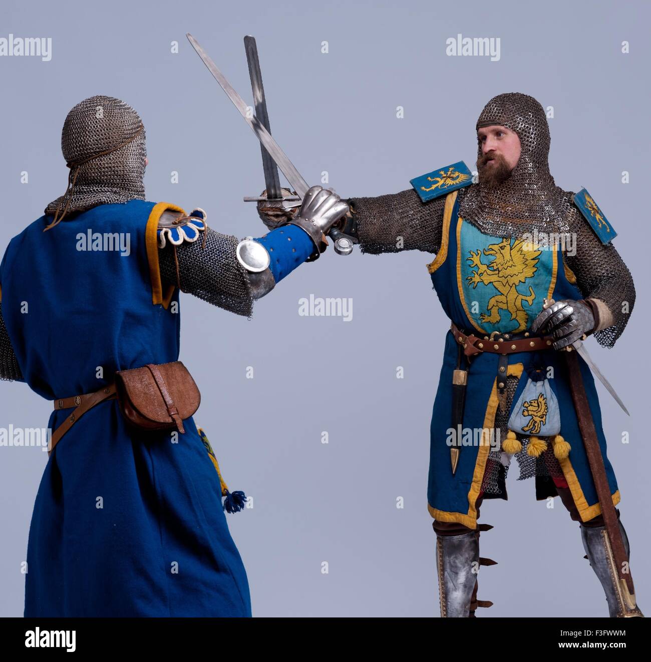 Two medieval knights fighting Stock Photo - Alamy