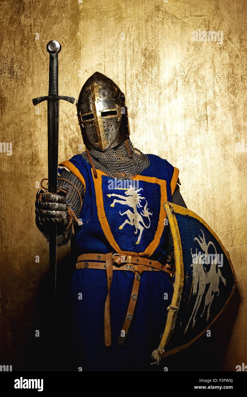 Medieval knight on golden background Stock Photo - Alamy