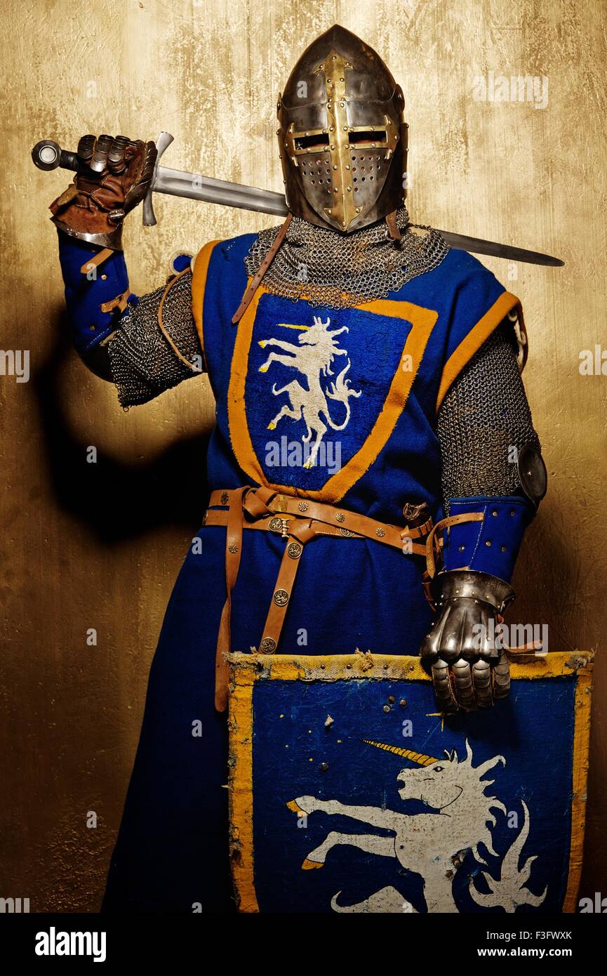 Medieval knight on golden background Stock Photo - Alamy