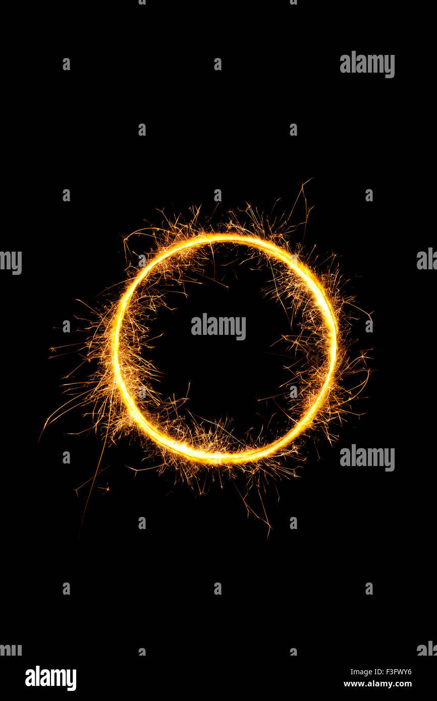 Sparkling light circle isolated on black background Stock Photo - Alamy