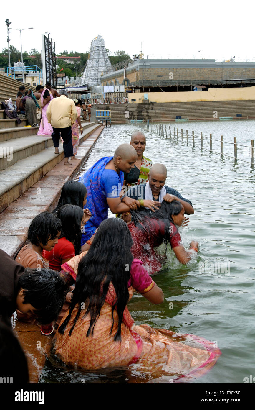 Devotees bathing the sacred tank (Pushkarini) at Tirumalai ; Tirupati ...
