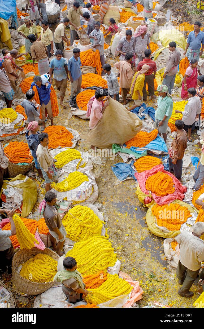 Flower sellers selling garland in bazaar ; Calcutta now Kolkata ; West ...